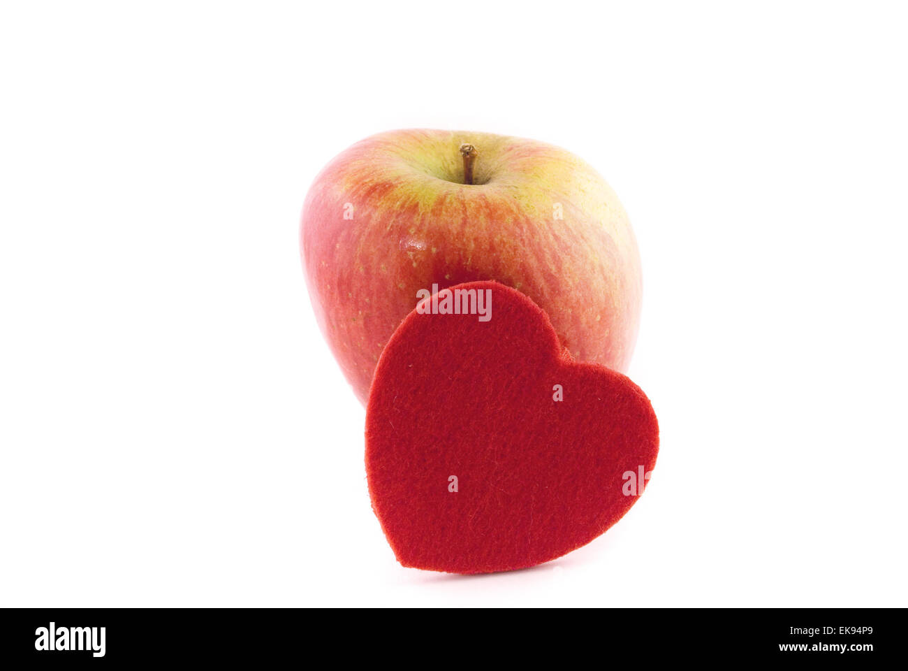 apple with the heart isolated on white Stock Photo - Alamy