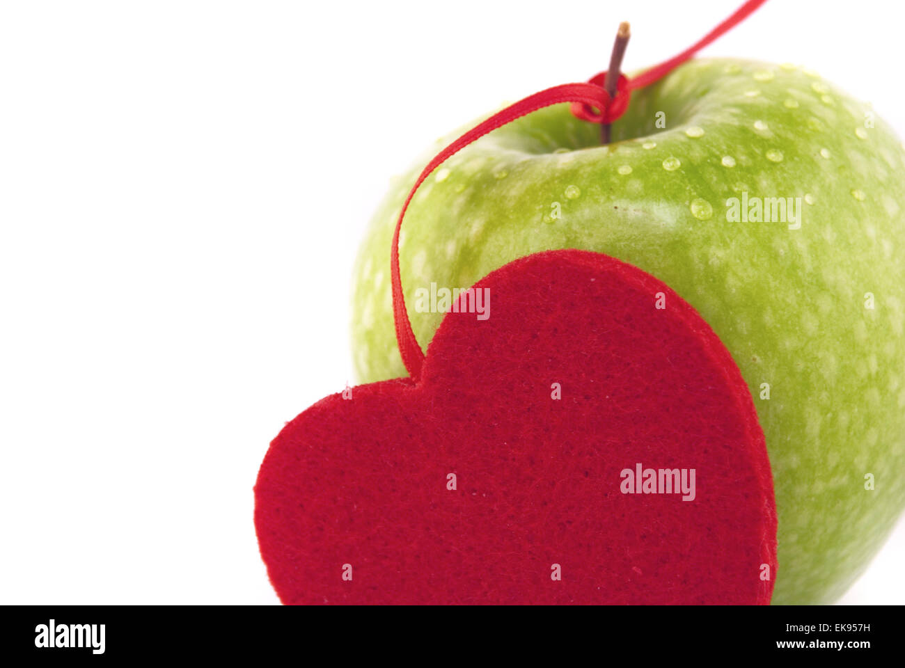 apple with the heart isolated on white Stock Photo - Alamy