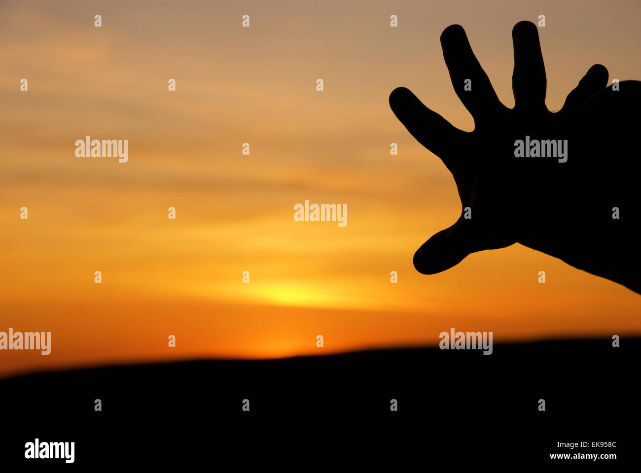 hand against the sky Stock Photo - Alamy