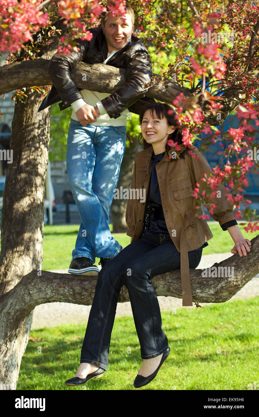 young couple at flowering tree Stock Photo - Alamy