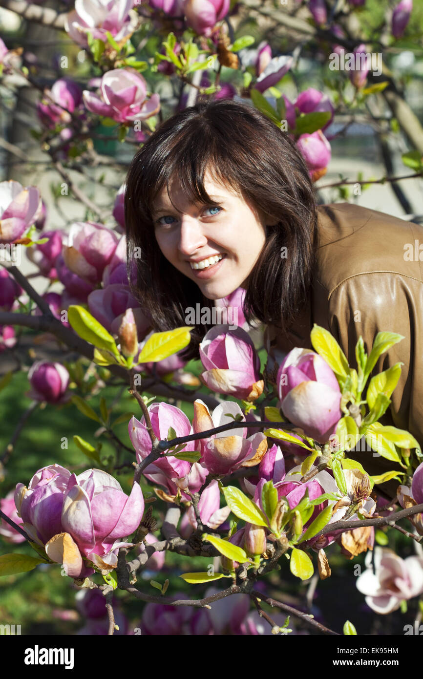young woman at flowering tree Stock Photo - Alamy