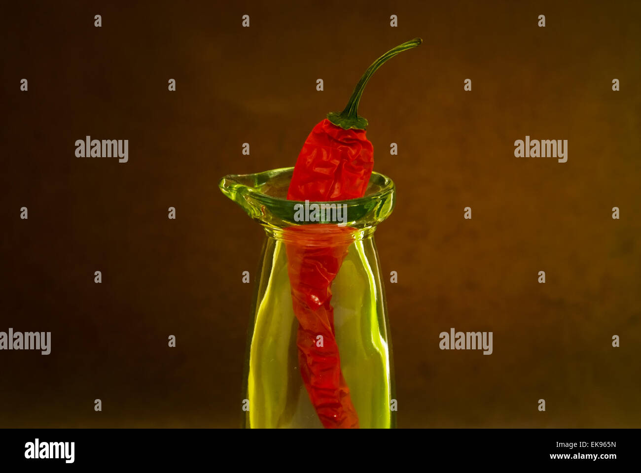 chili pepper in a glass bottle Stock Photo - Alamy