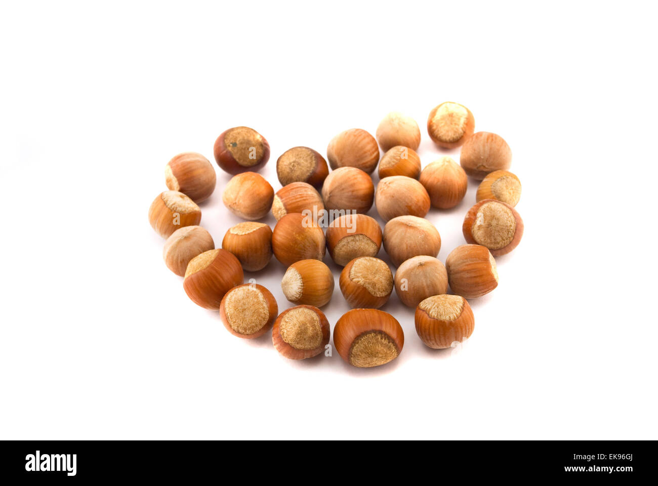 hazelnuts in the shape of a heart isolated on white Stock Photo - Alamy