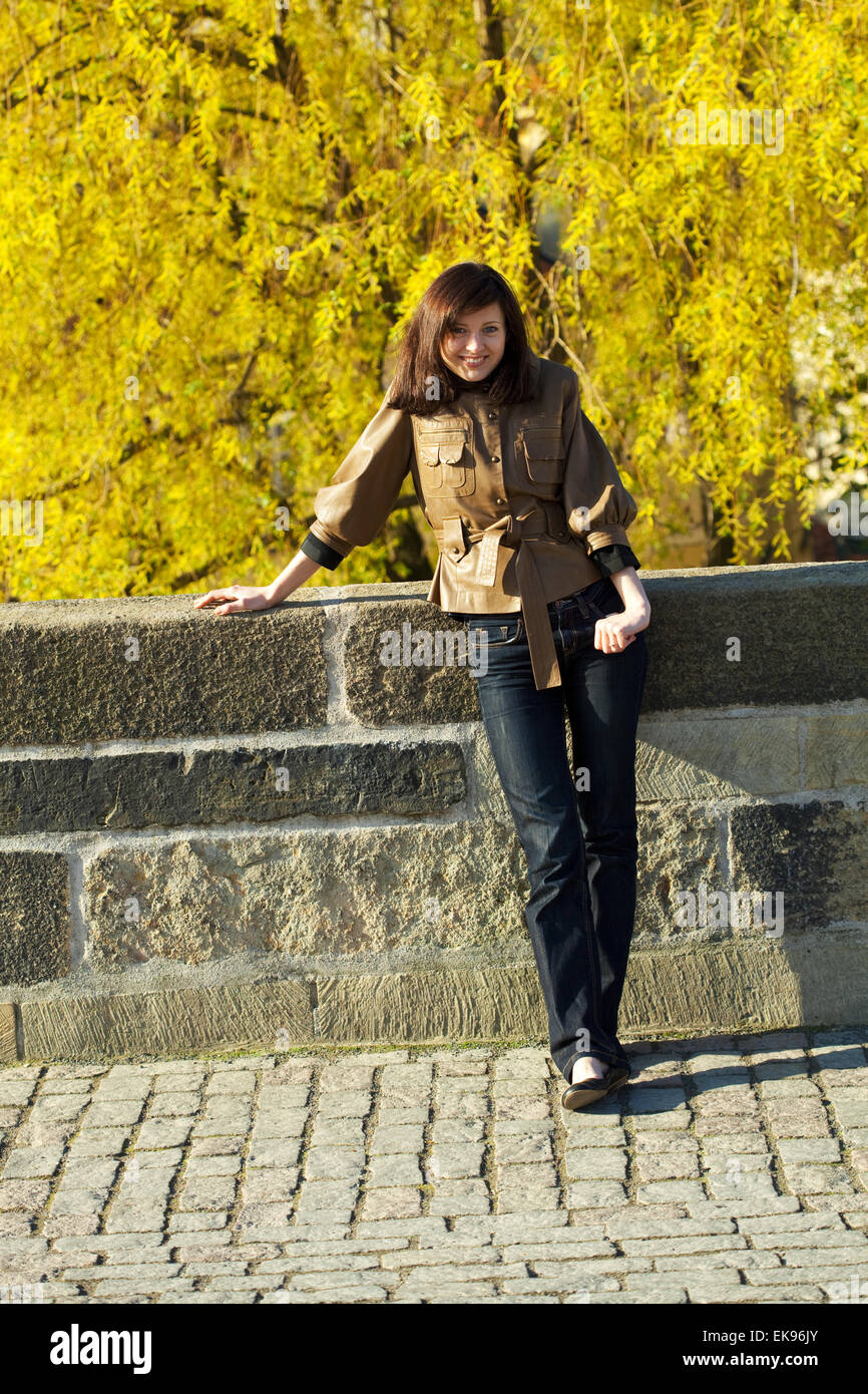 beautiful young woman standing on the bridge Stock Photo - Alamy
