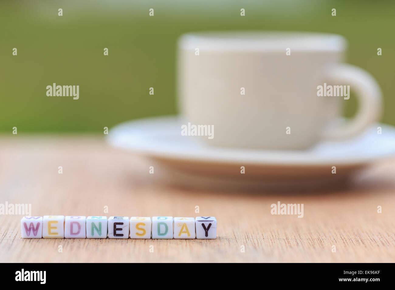 Wednesday written in letter beads and a coffee cup on table Stock Photo ...
