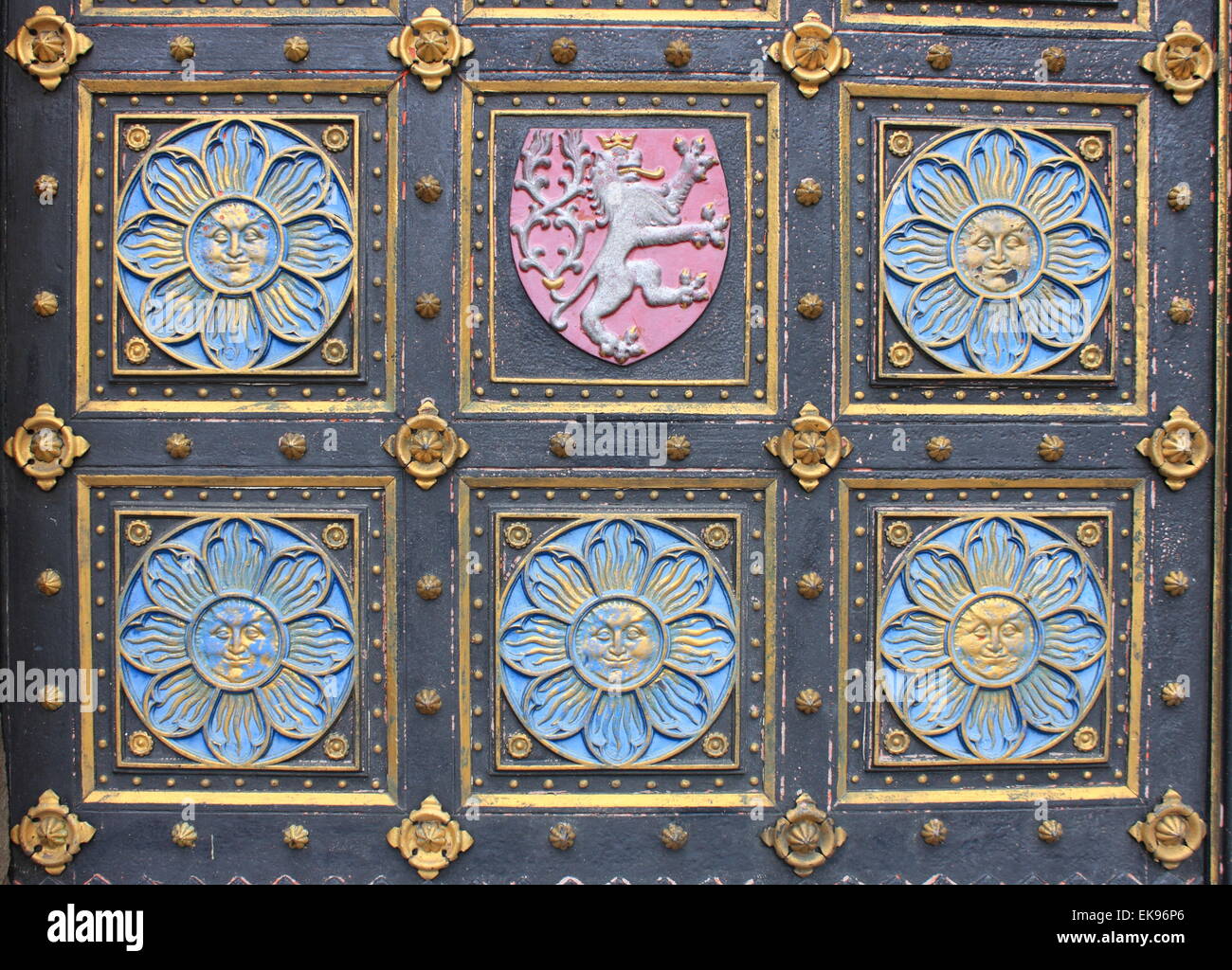 Detailed view of a wooden door with emblems Stock Photo - Alamy