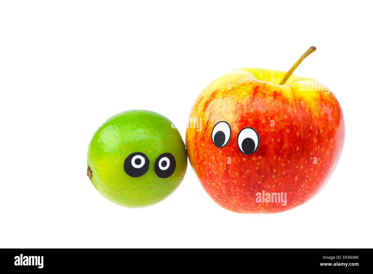 lime and apple with eyes and faces isolated on white Stock Photo - Alamy