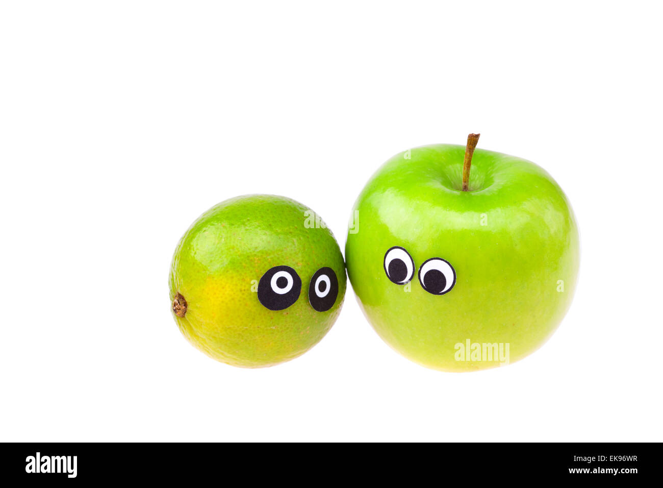lime and apple with eyes and faces isolated on white Stock Photo - Alamy