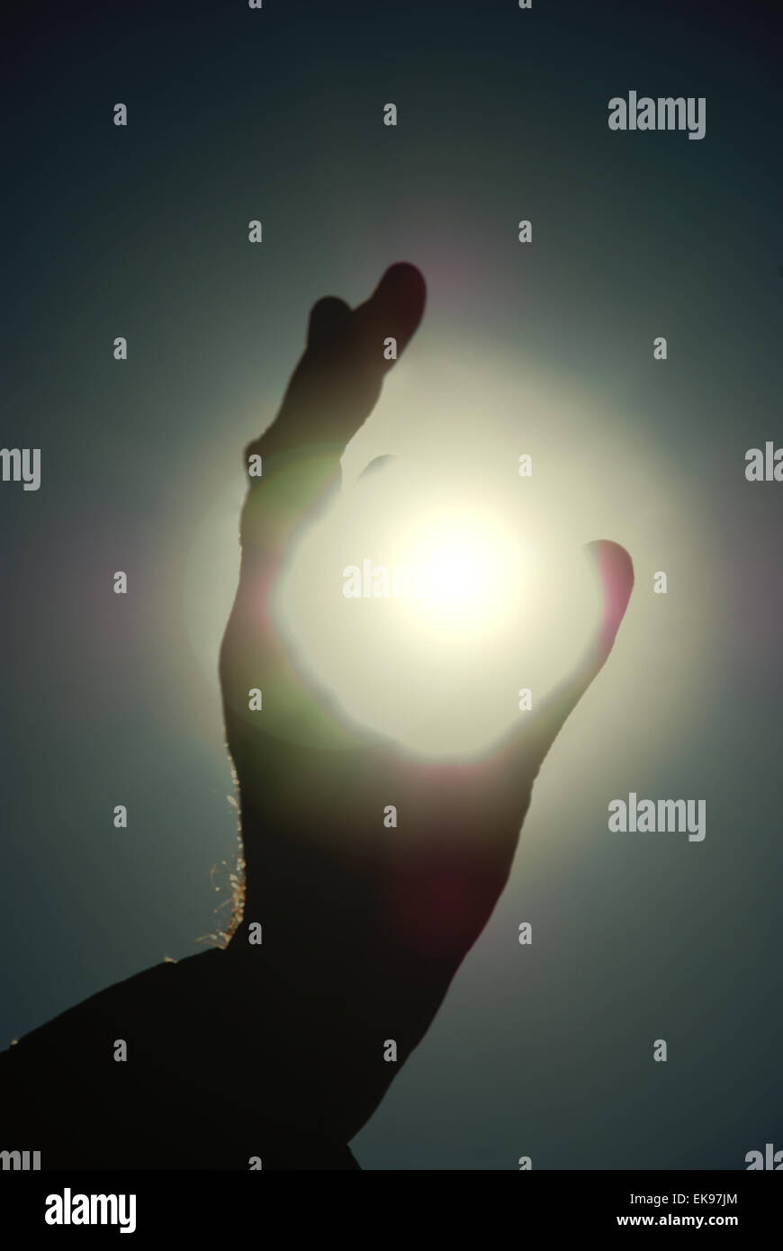 man holding a sun in his hands against the sky Stock Photo - Alamy