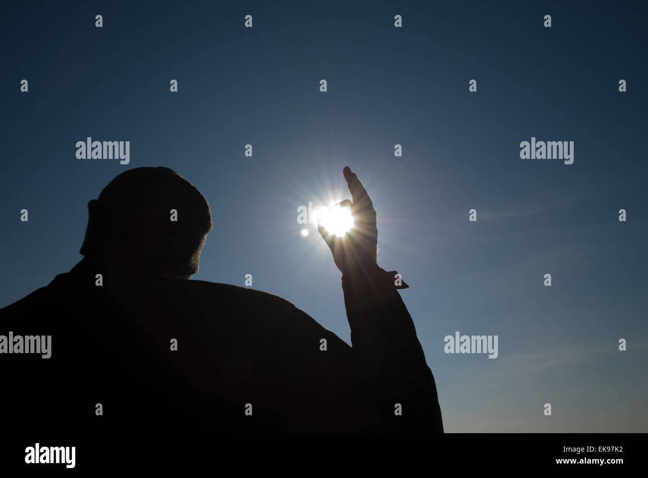 man holding a sun in his hands against the sky Stock Photo - Alamy