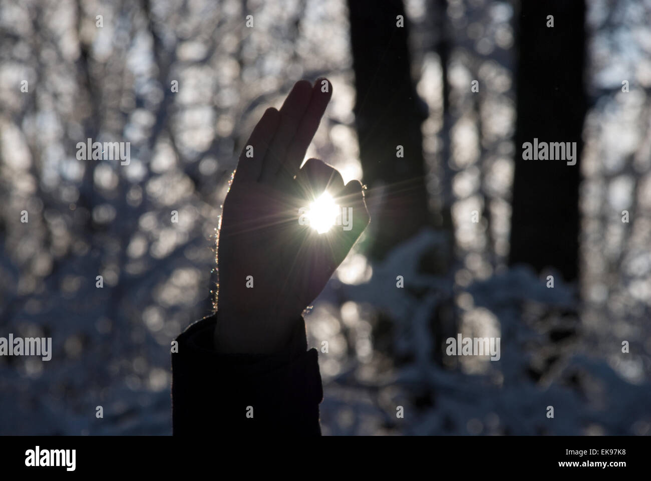 man holding a sun in his hands against the sky Stock Photo - Alamy