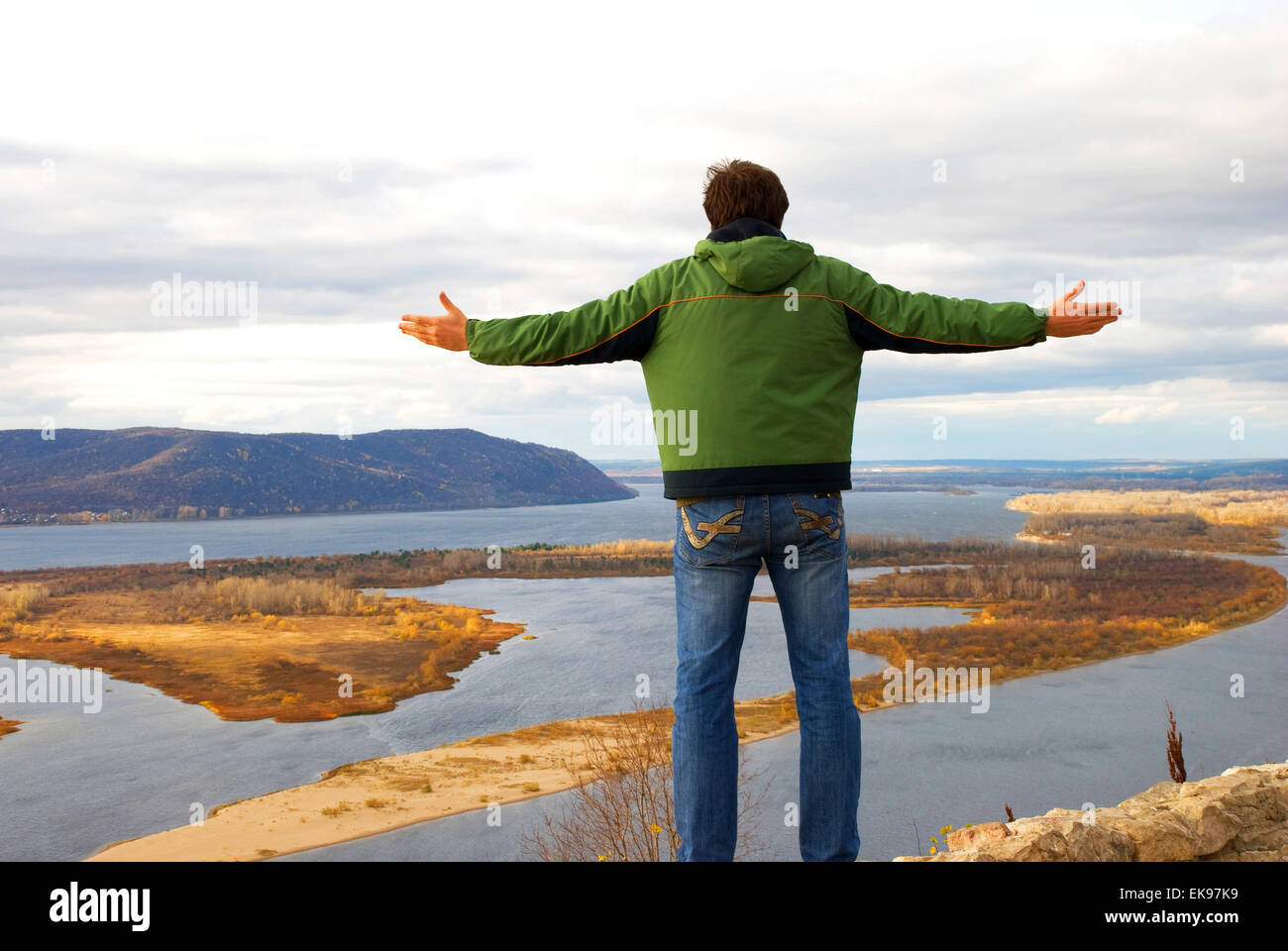Man standing on meadow at sunset hi-res stock photography and images ...
