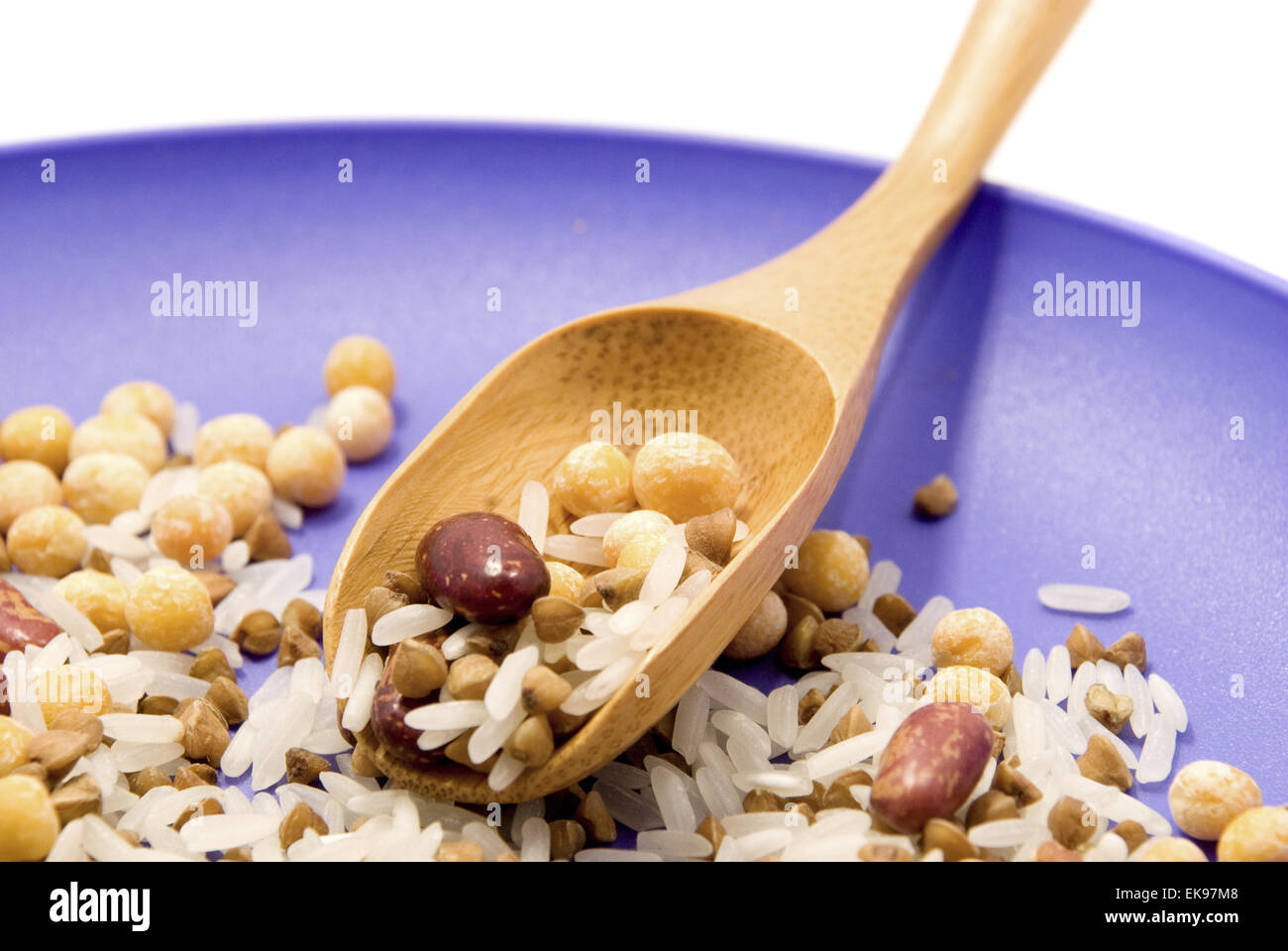 grains in a spoon on a plate Stock Photo - Alamy