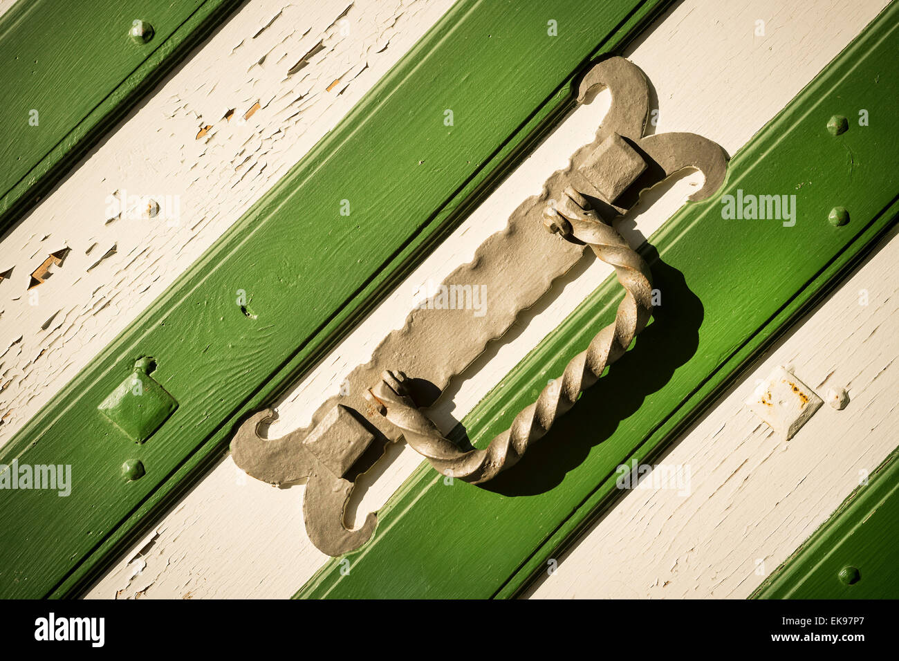 Metal handle on white green gate Stock Photo - Alamy