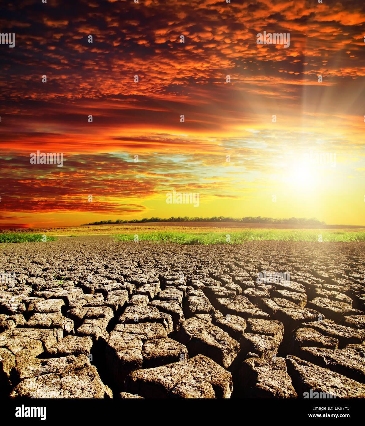 drought earth with red clouds and sunset Stock Photo - Alamy