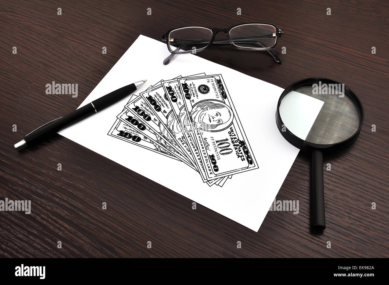 drawing dollars on paper Stock Photo - Alamy