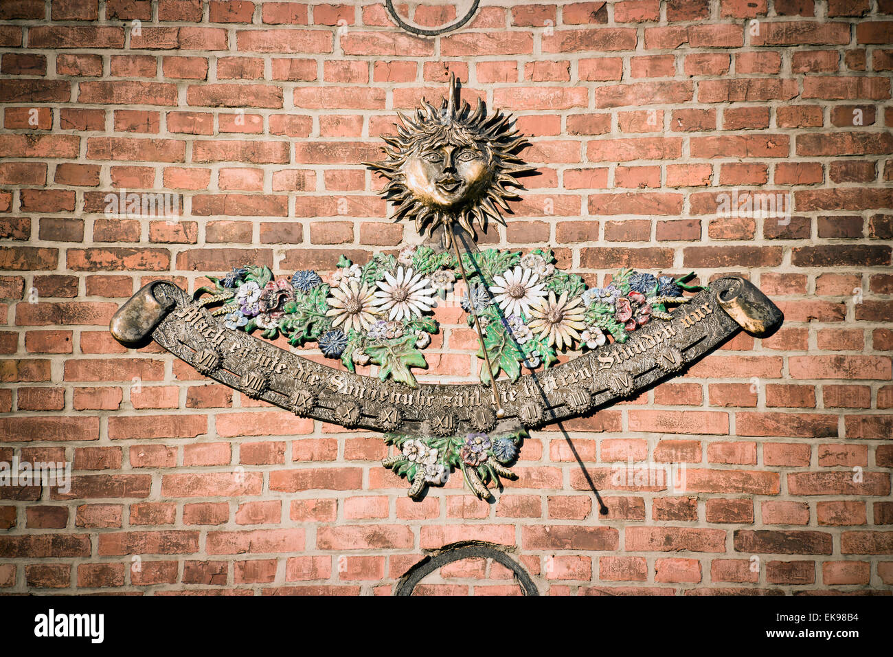 Sundial on brick wall Stock Photo - Alamy