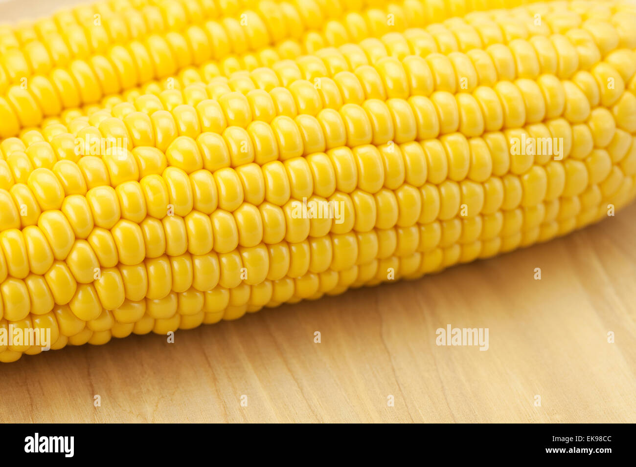 Corn lying on a cutting board Stock Photo - Alamy