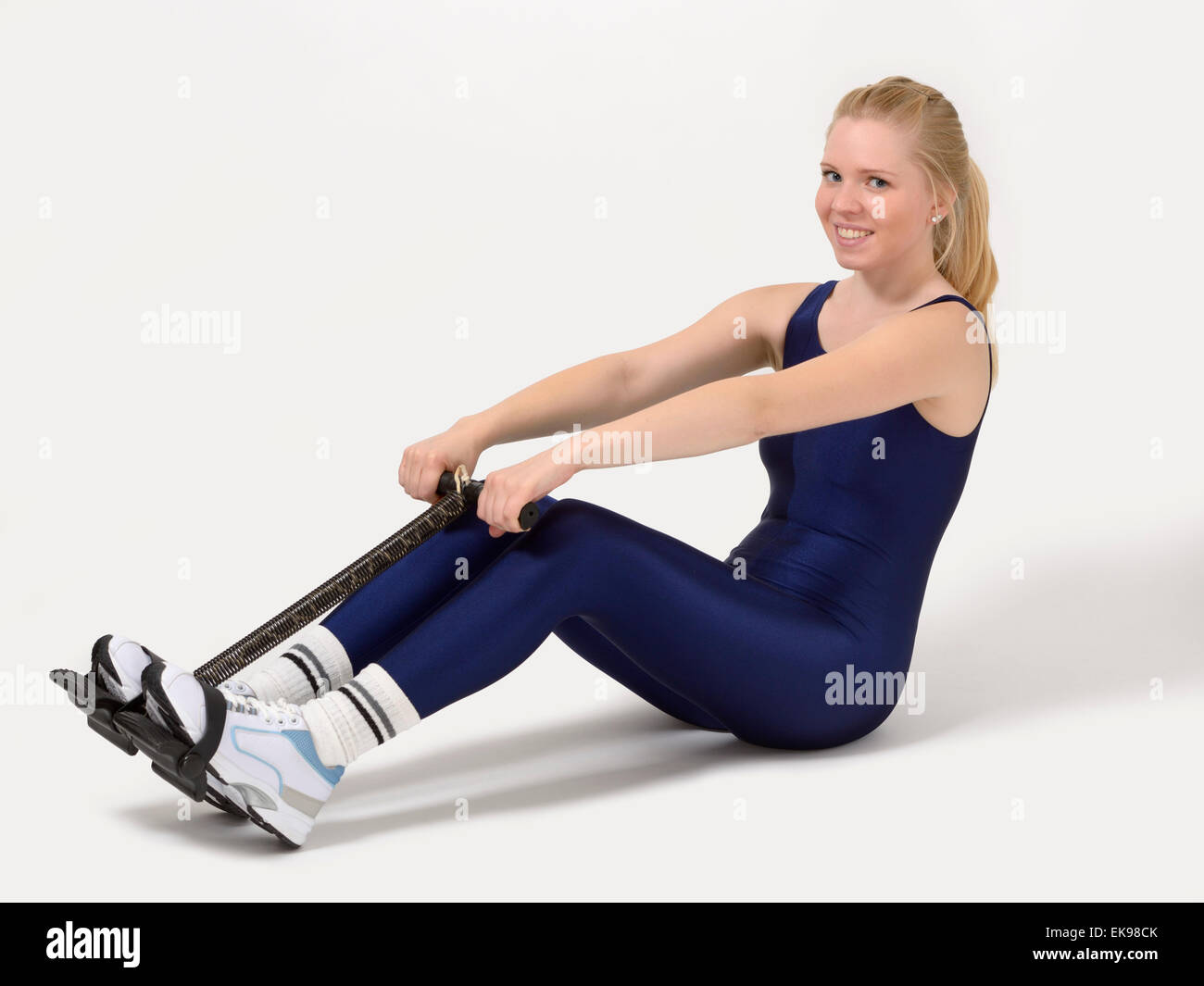 Young woman doing workout. She is wearing a shiny spandex catsuit Stock ...
