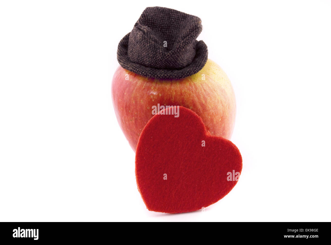 apple in the hat and the heart isolated on white Stock Photo - Alamy