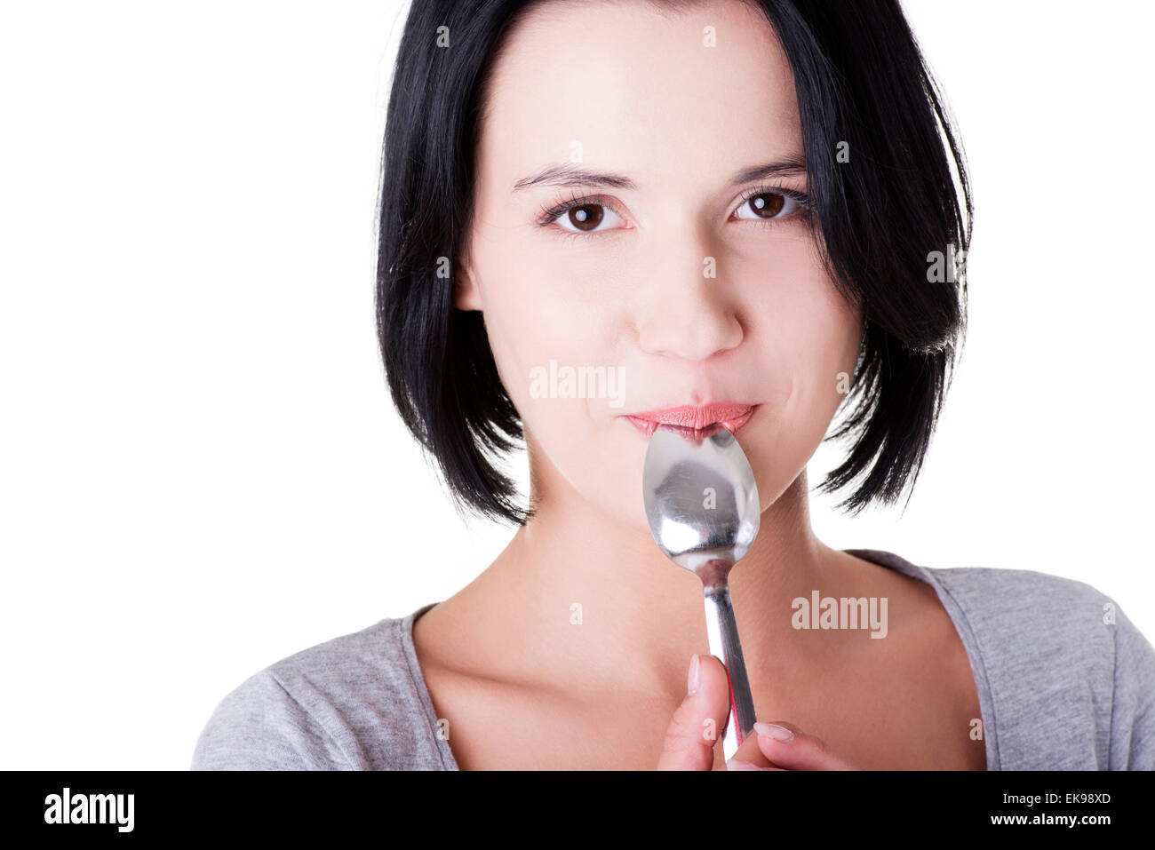 Young smiling woman with spoon Stock Photo - Alamy