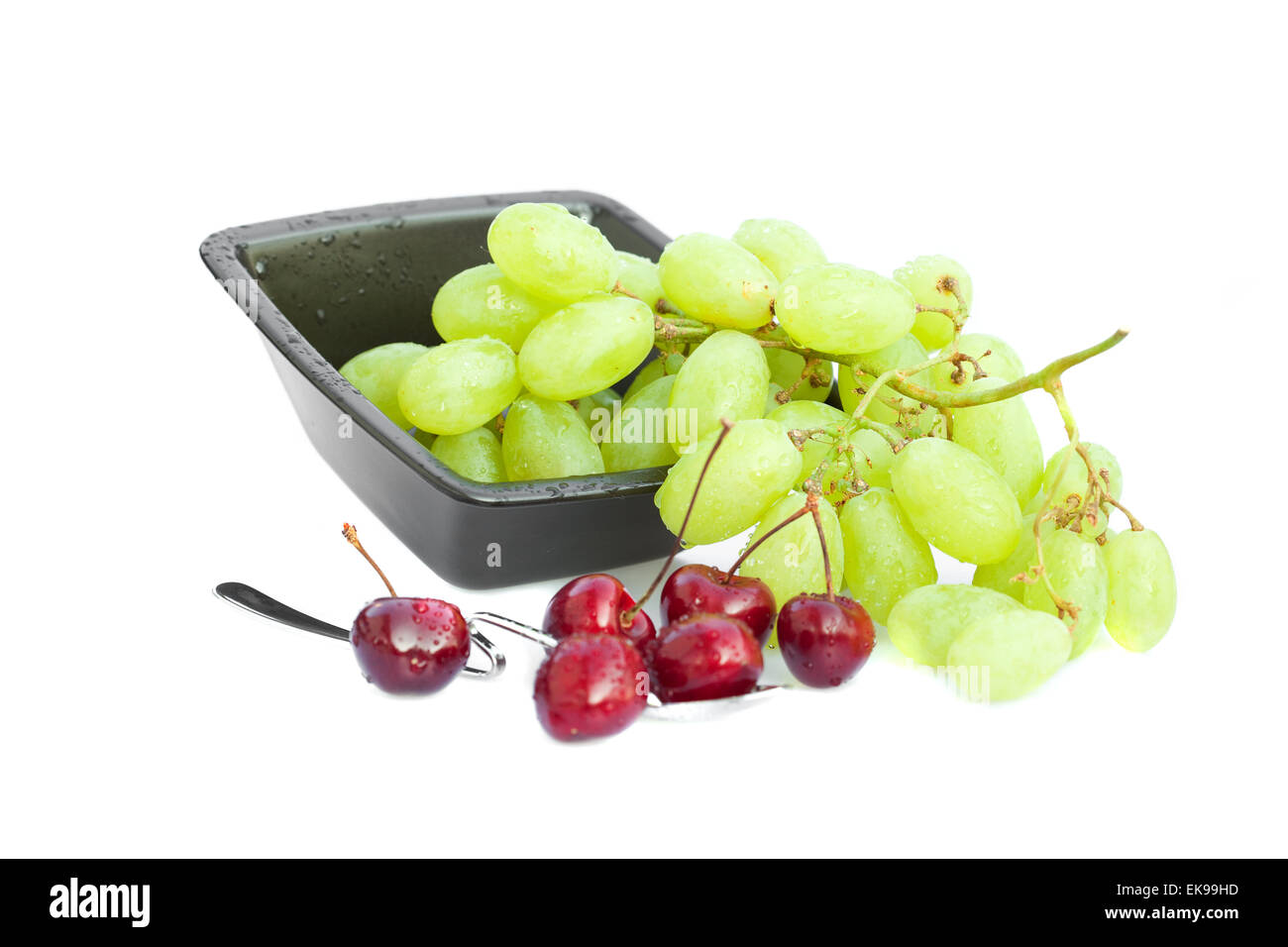 cup of grapes and cherries isolated on white Stock Photo - Alamy