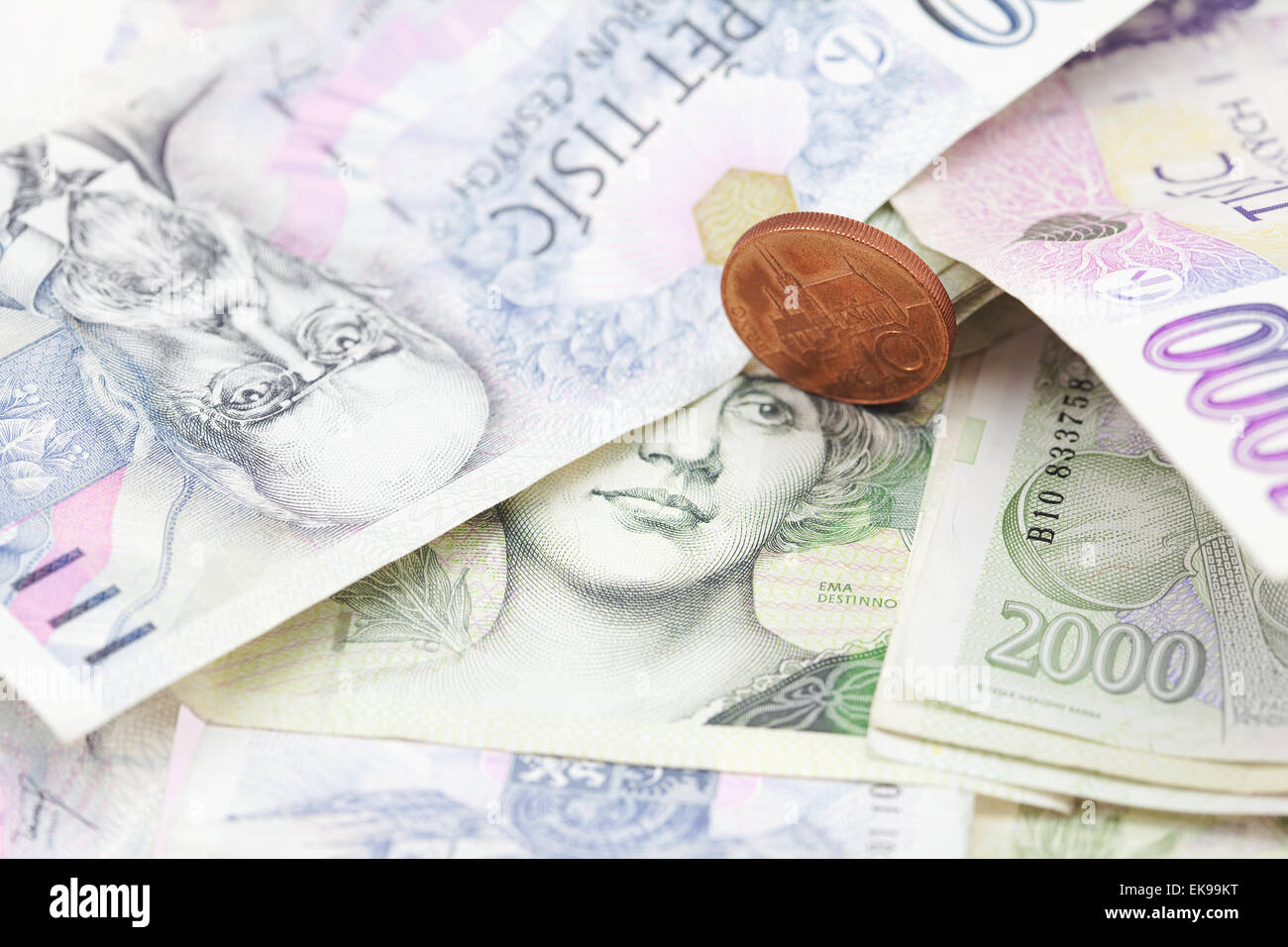 stack of paper money and coins Stock Photo - Alamy