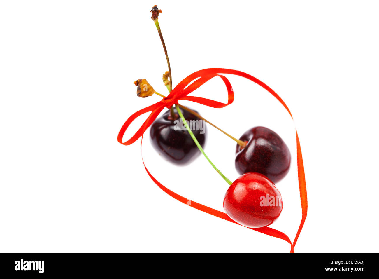 cherries tied with ribbon isolated on white Stock Photo - Alamy