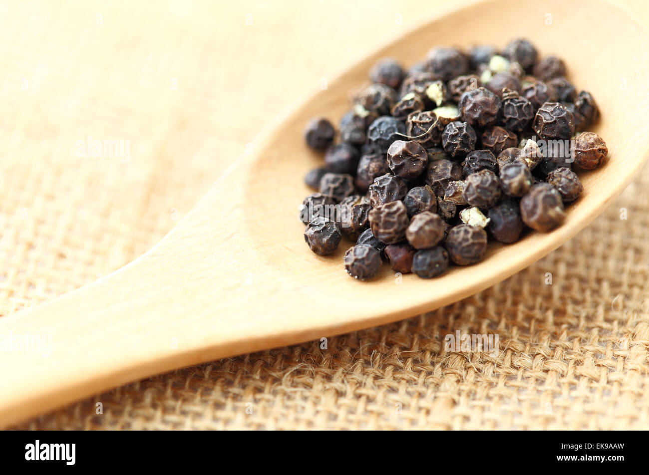 pepper in wooden spoon Stock Photo - Alamy