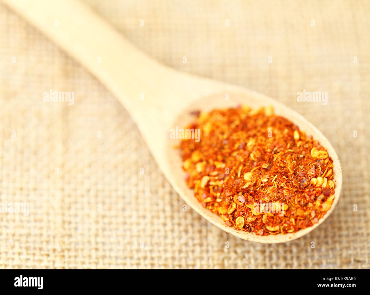 Chili powder on wooden spoon Stock Photo - Alamy
