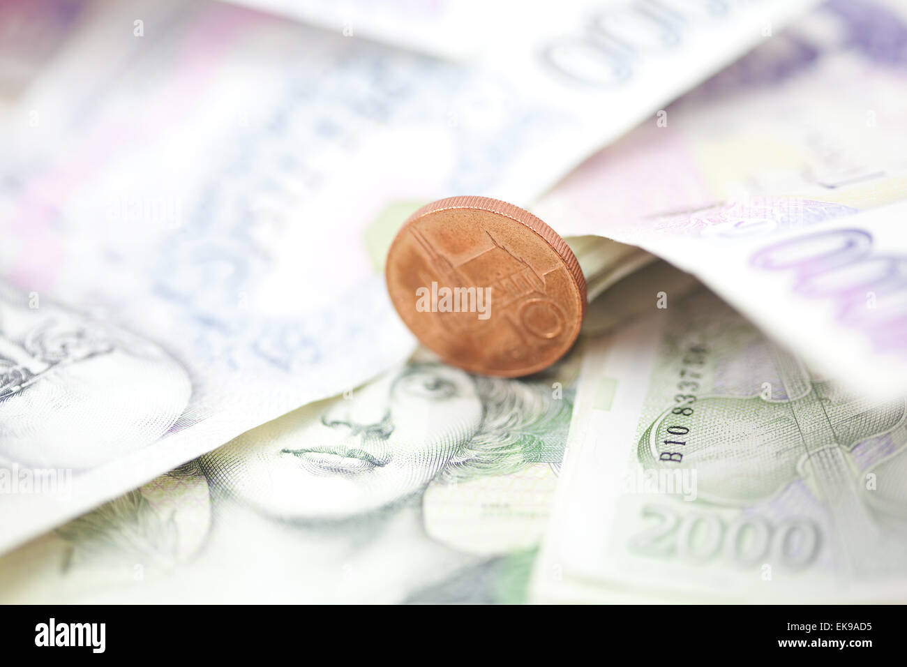 stack of paper money and coins Stock Photo - Alamy