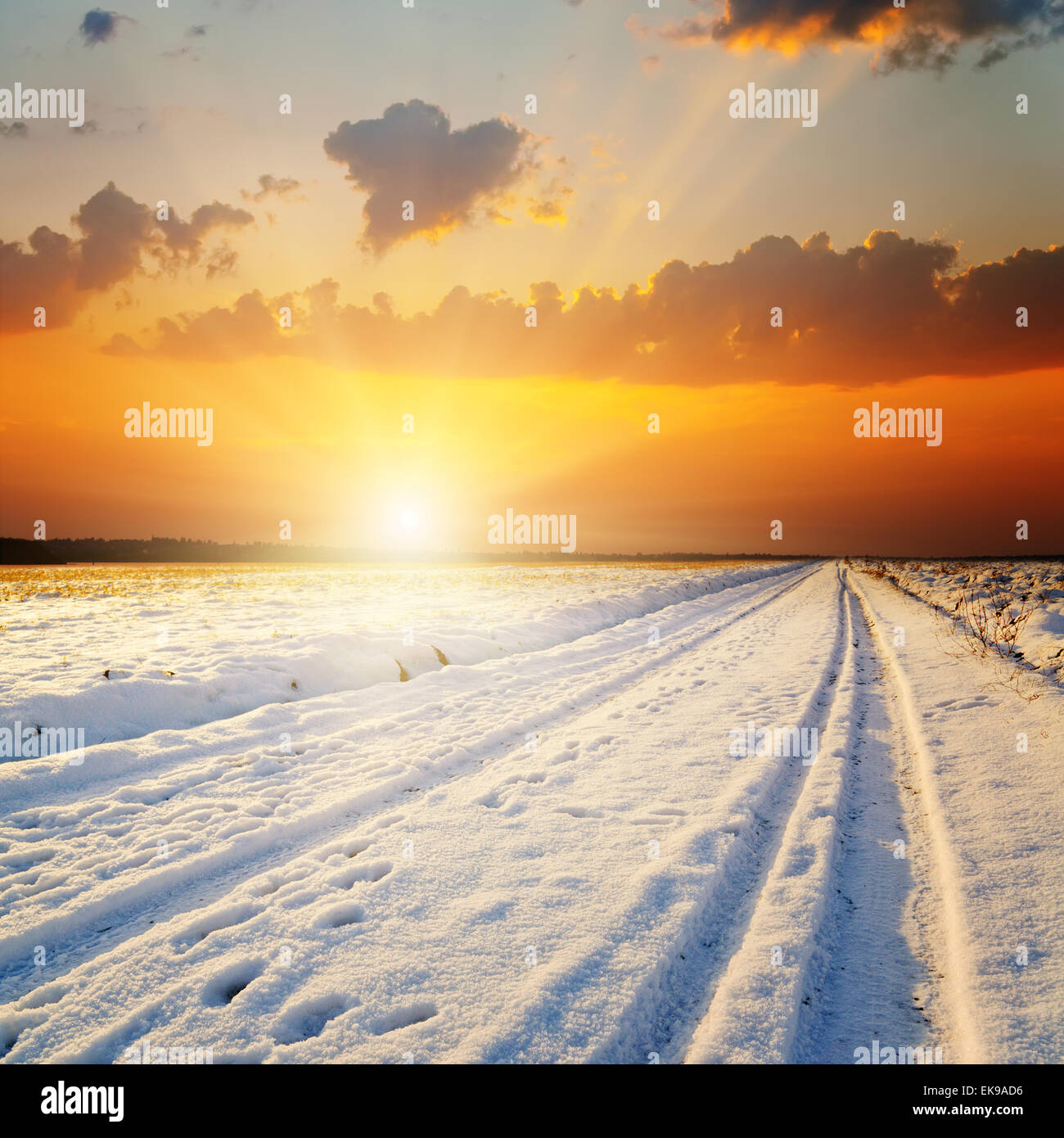 winter landscape. sunset over road with snow Stock Photo - Alamy