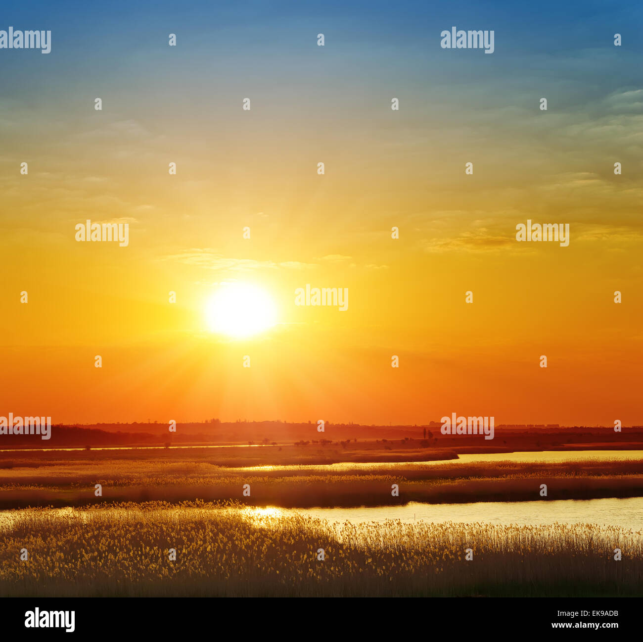 red sunset over river Stock Photo - Alamy