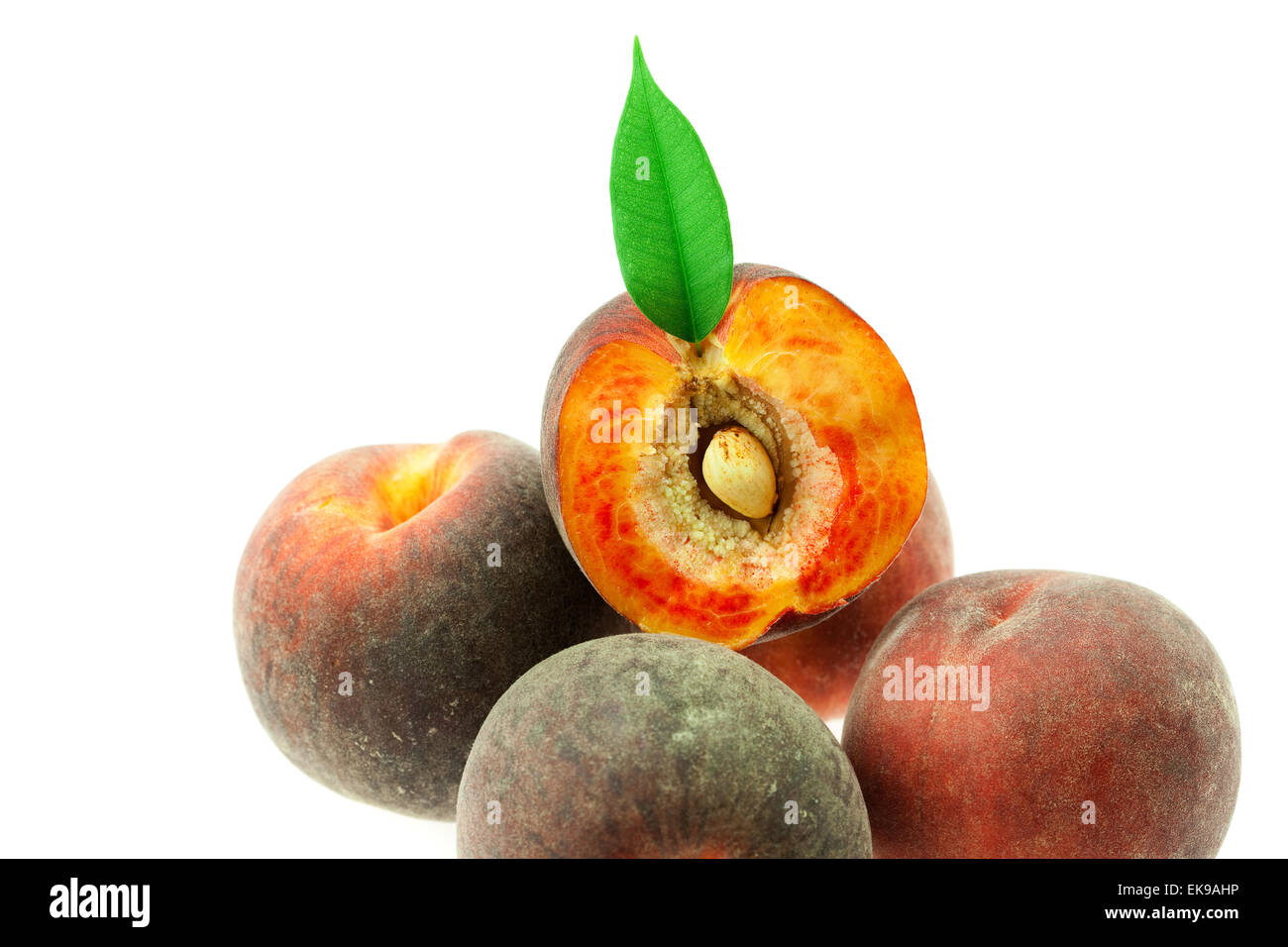 peaches with green leaf isolated on white Stock Photo - Alamy