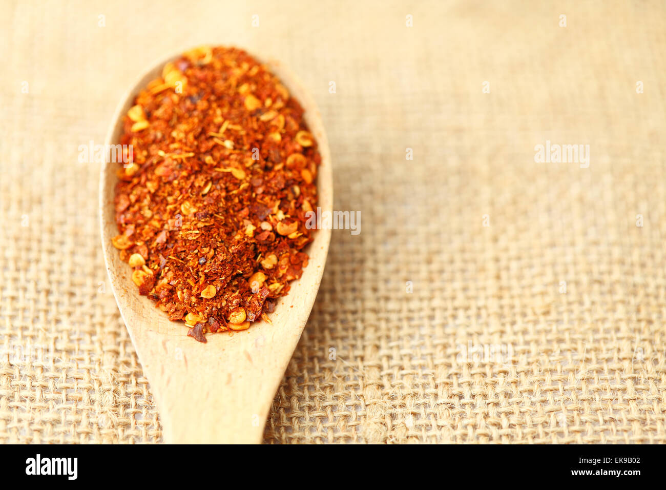 Chili powder on wooden spoon Stock Photo - Alamy