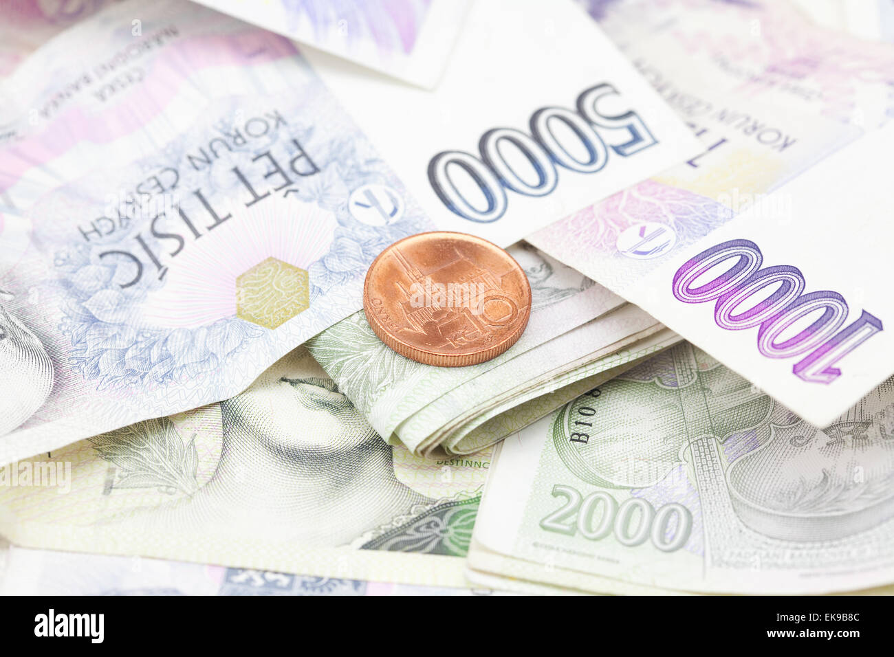 stack of paper money and coins Stock Photo - Alamy