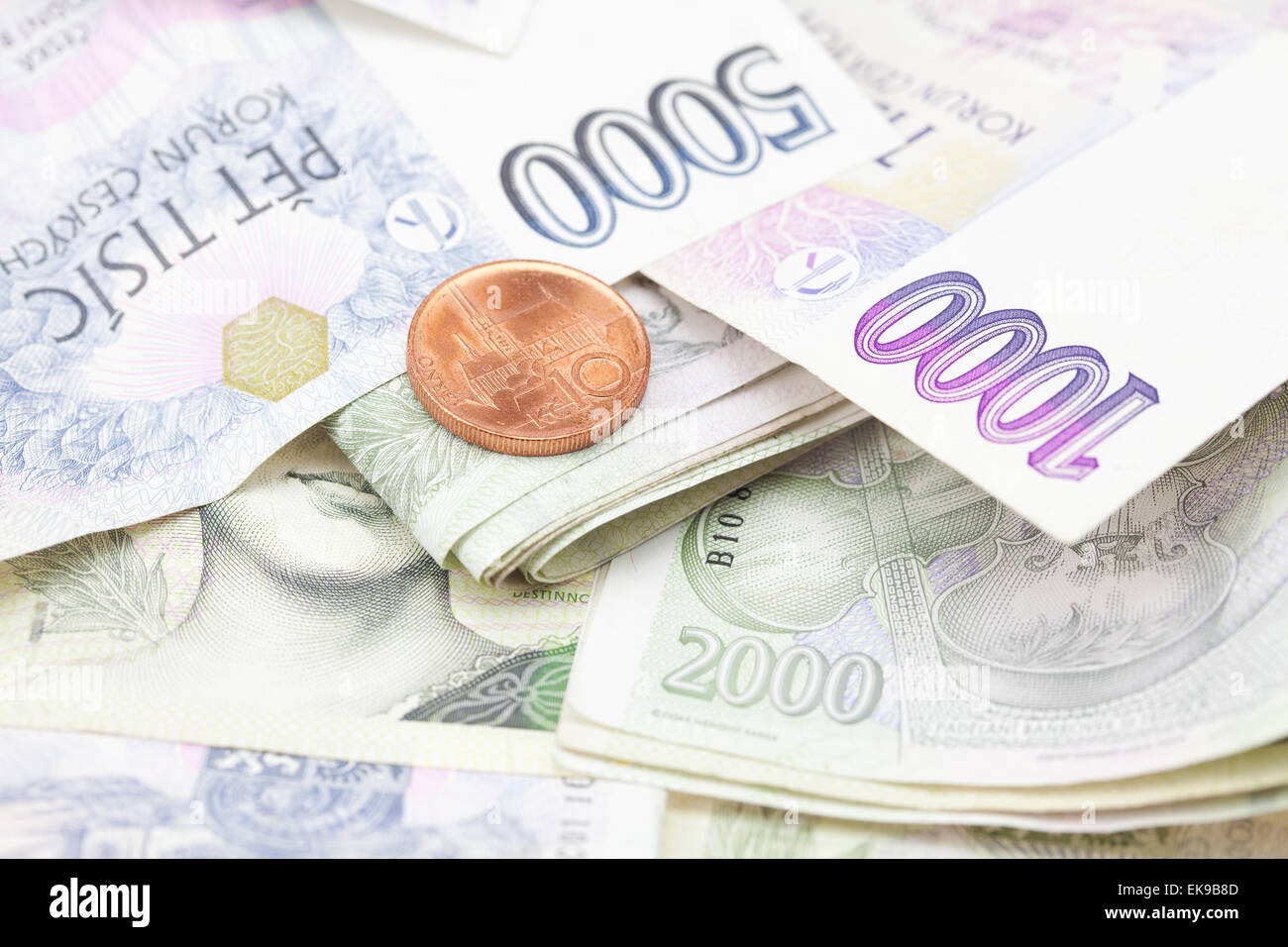 stack of paper money and coins Stock Photo - Alamy