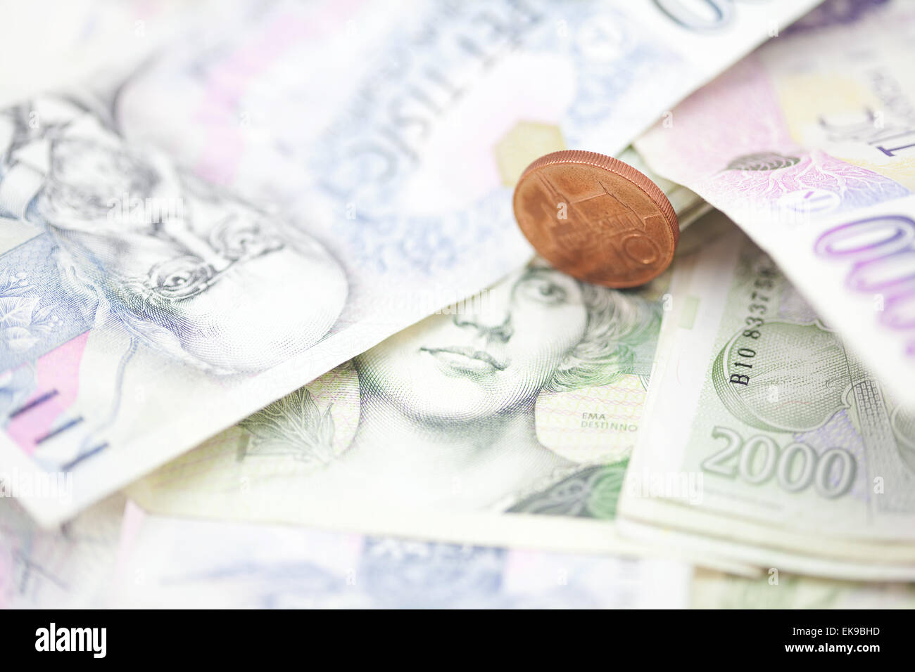 stack of paper money and coins Stock Photo - Alamy