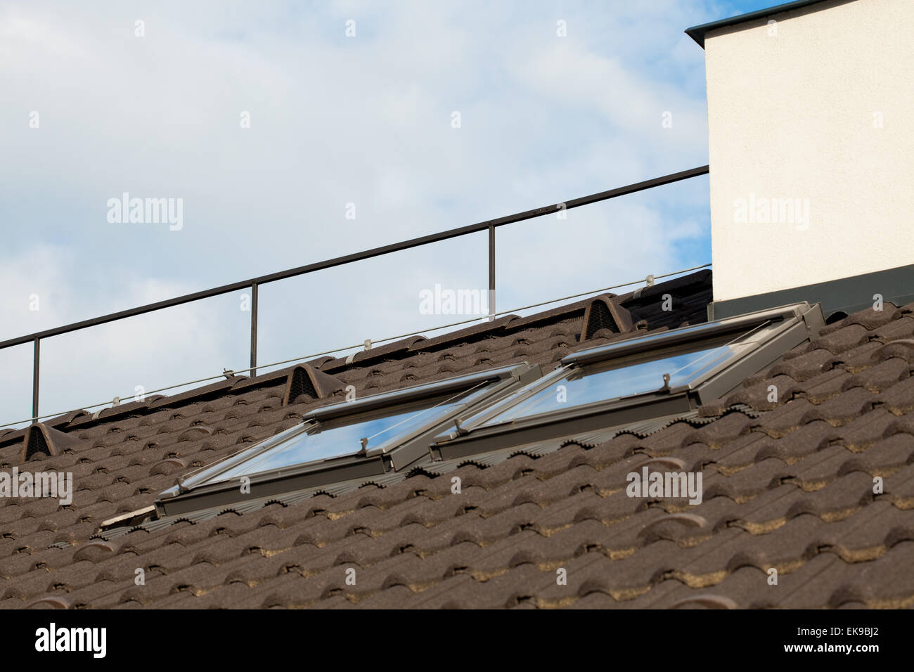 Tiled roof and dormer windows on the skyline Stock Photo - Alamy