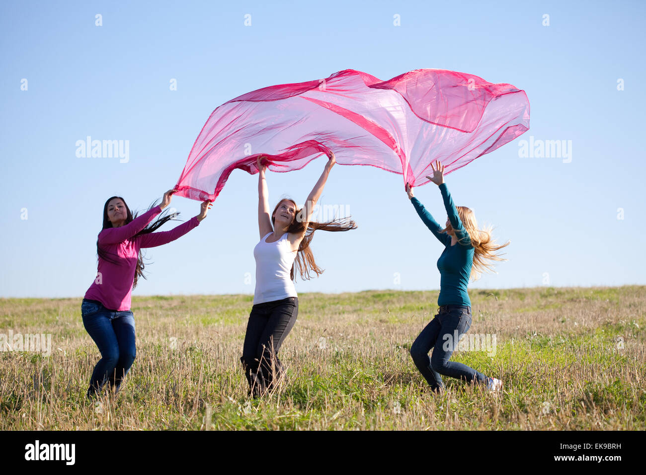 beautiful teenager woman jumping with a thin tissue outdoor Stock Photo ...
