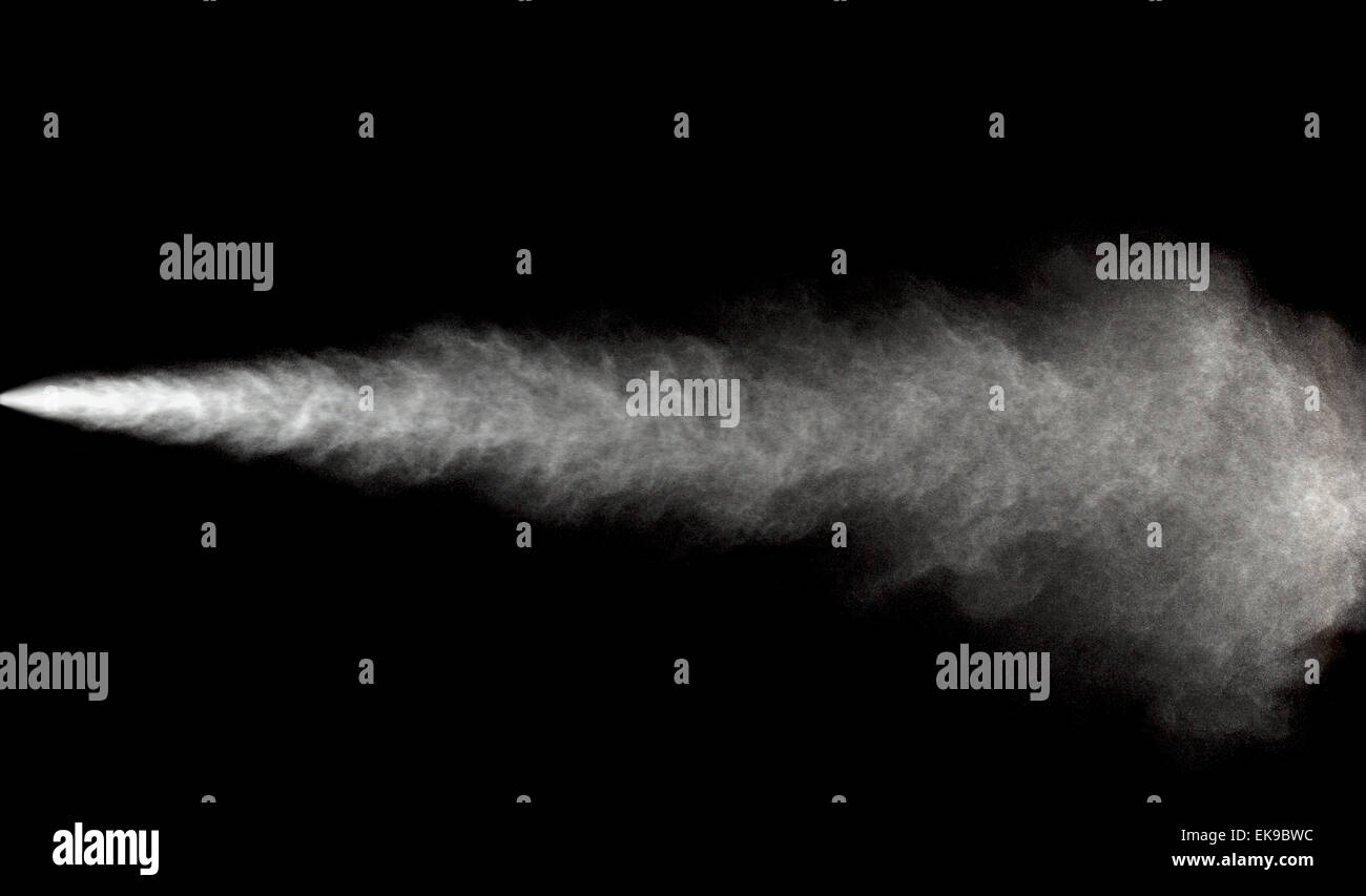 Spraying of water in motion on black background Stock Photo - Alamy