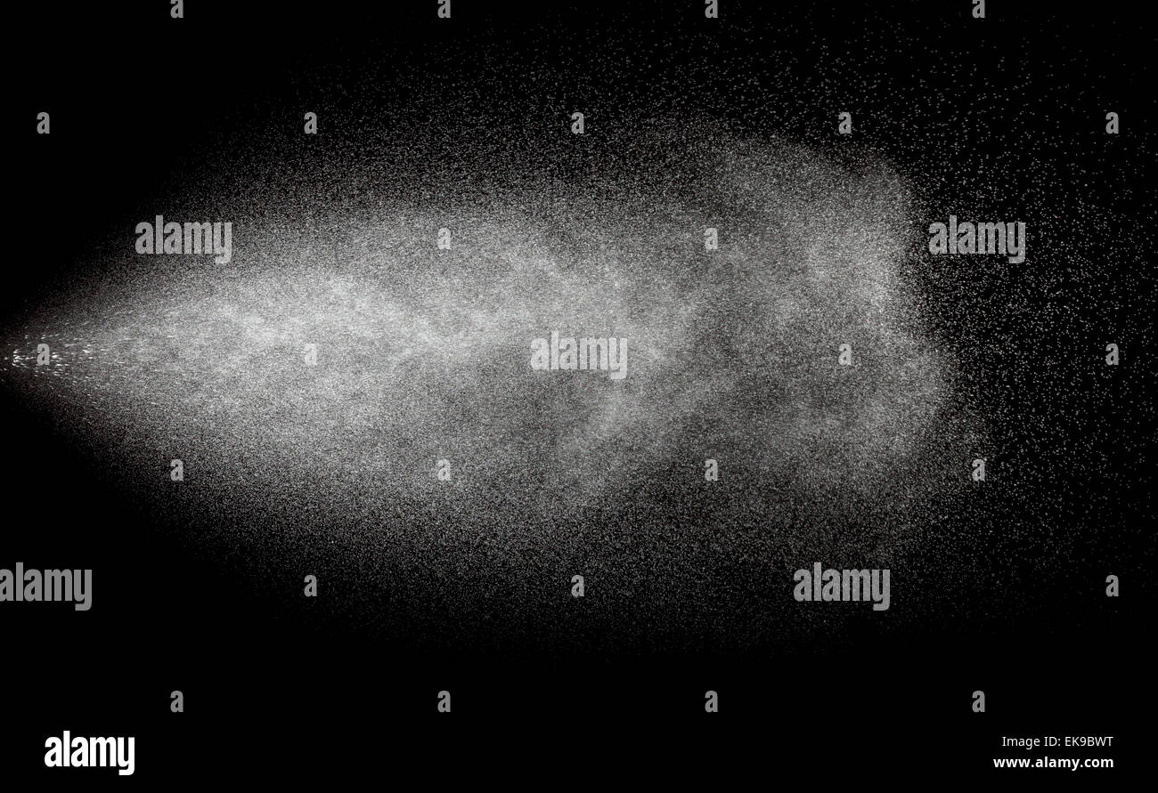 Spraying of water in motion isolate on black background Stock Photo - Alamy