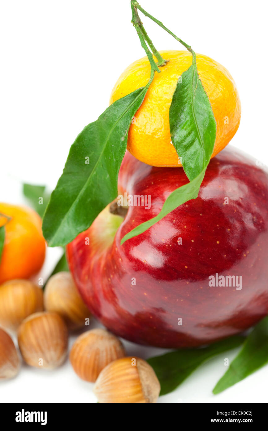 red apple, mandarin with green leaves and nuts isolated on whi Stock ...