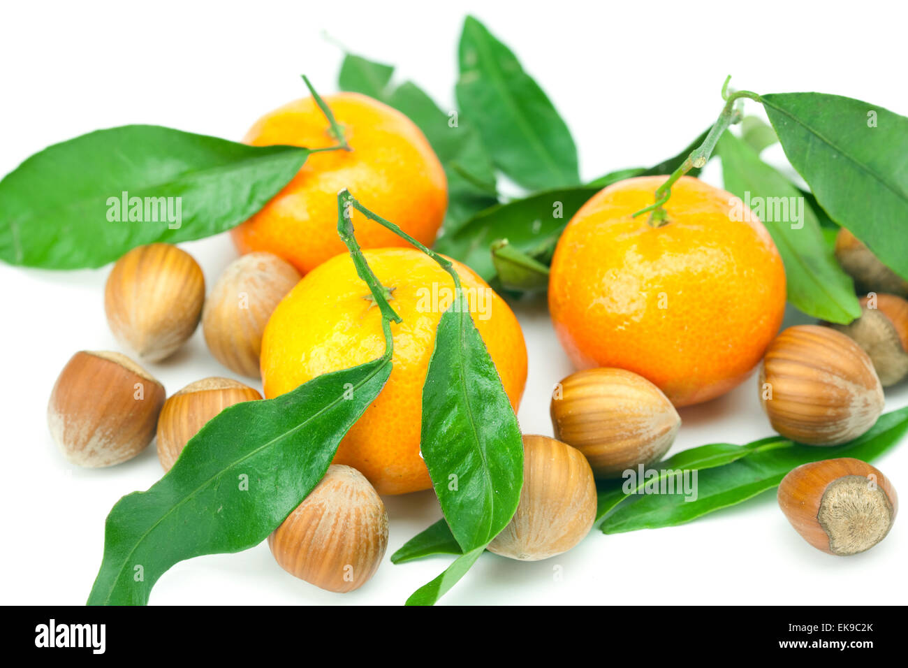 mandarin with green leaves and nuts isolated on white Stock Photo - Alamy