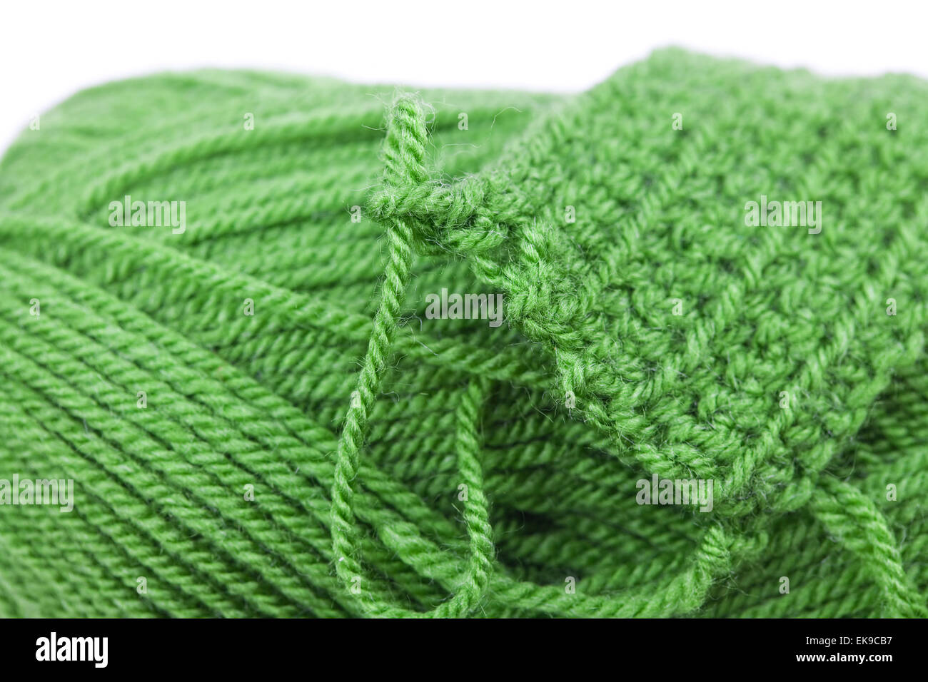 Skein of wool and knitted piece isolated on white Stock Photo - Alamy