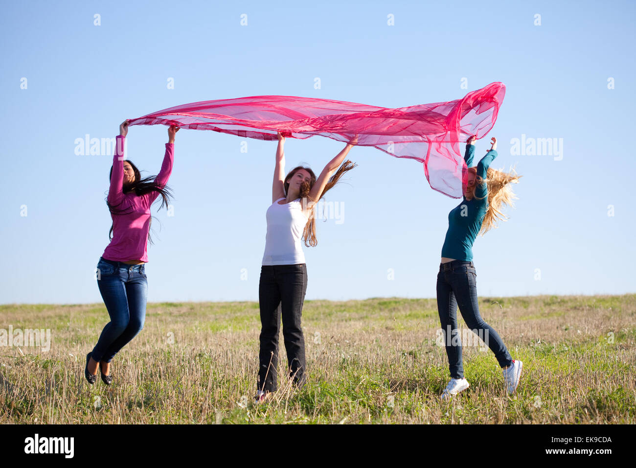 beautiful teenager woman jumping with a thin tissue outdoor Stock Photo ...