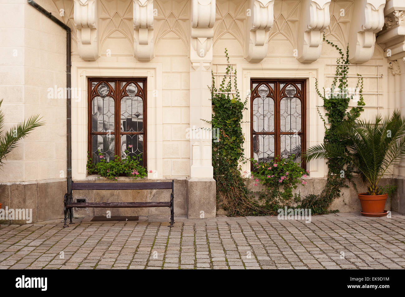 window and a bench in the courtyard Stock Photo - Alamy