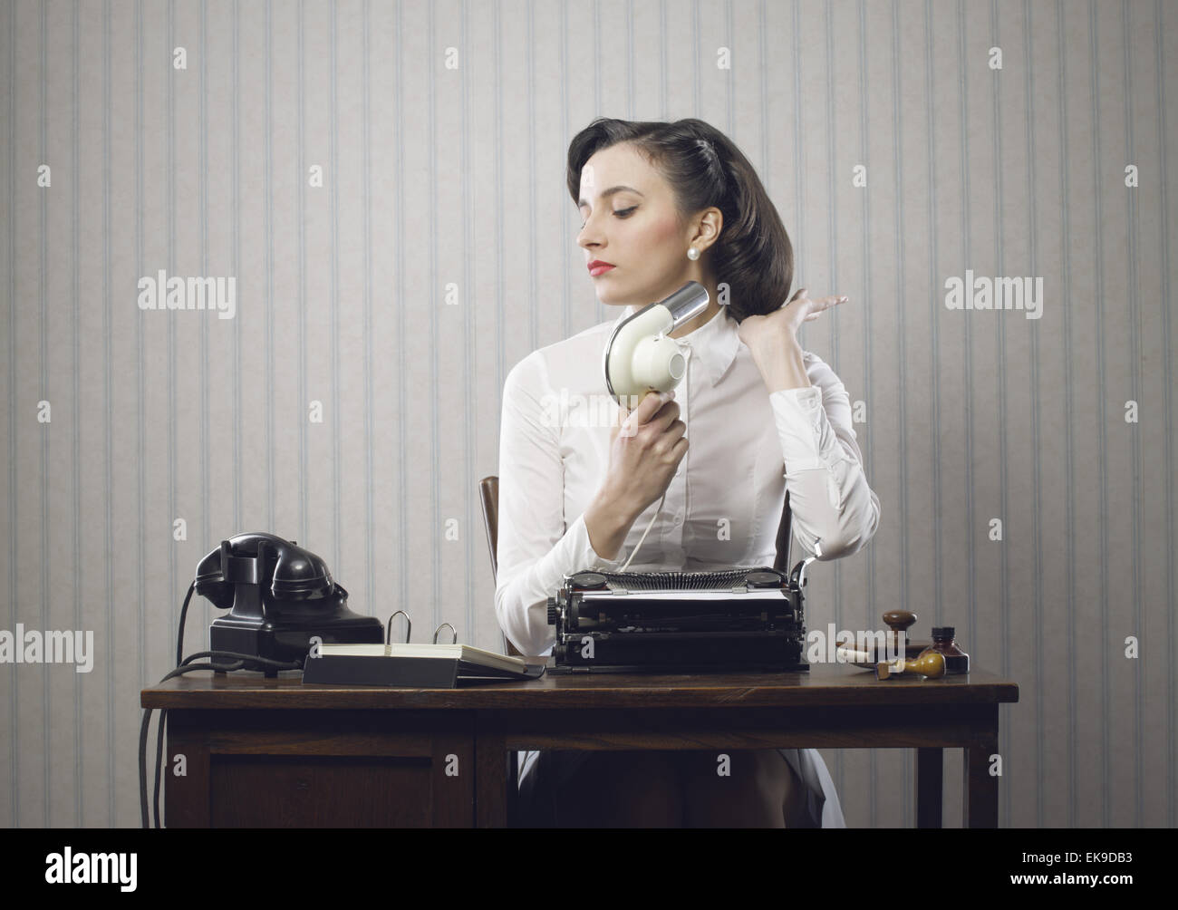 Business woman drying her hair in office Stock Photo - Alamy