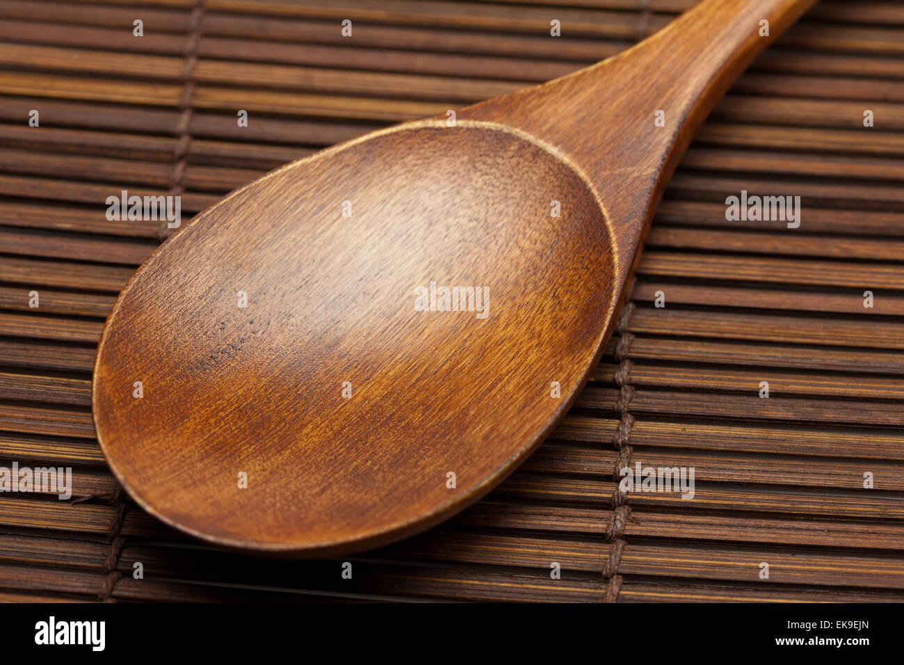 wooden spoon on a bamboo mat Stock Photo - Alamy