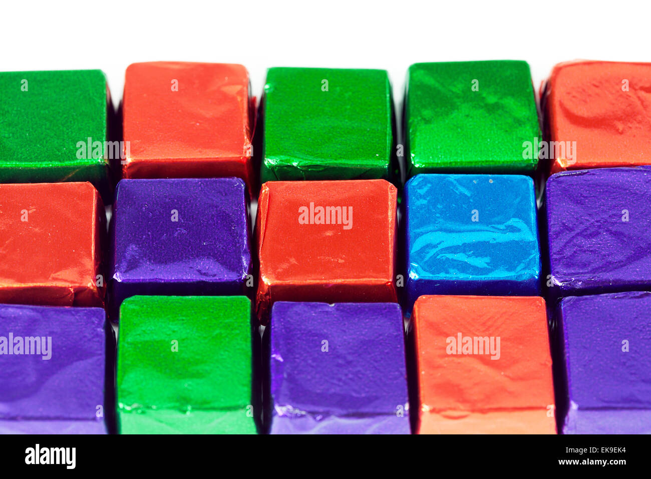 candies in shiny wrappers isolated on white Stock Photo - Alamy
